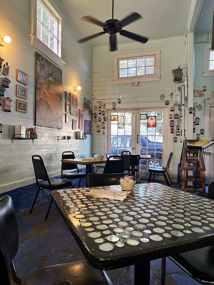 High ceilings, local art, and bottle-cap tables create the perfect stage for breakfast drama to unfold in this cozy space.