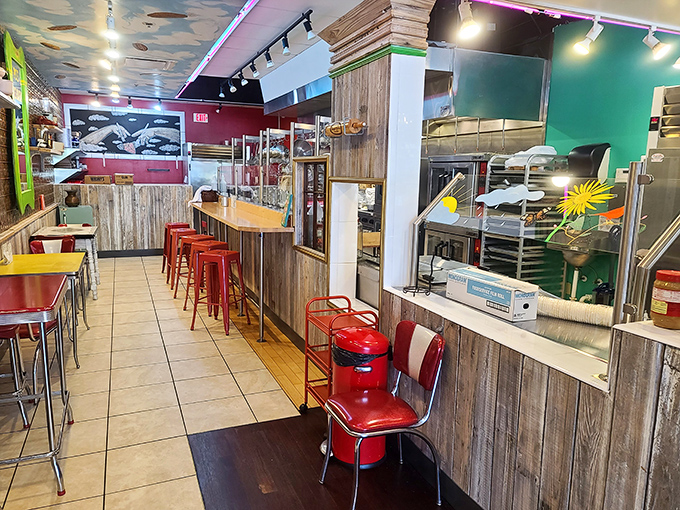 Retro red chairs and reclaimed wood create that perfect "come as you are" vibe where comfort meets craftsmanship, just like the pies themselves.
