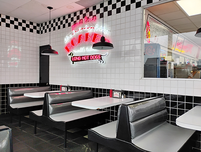 Black and white tiles meet neon glow &ndash; this isn't interior design, it's a declaration that some things never need updating when they're already perfect.