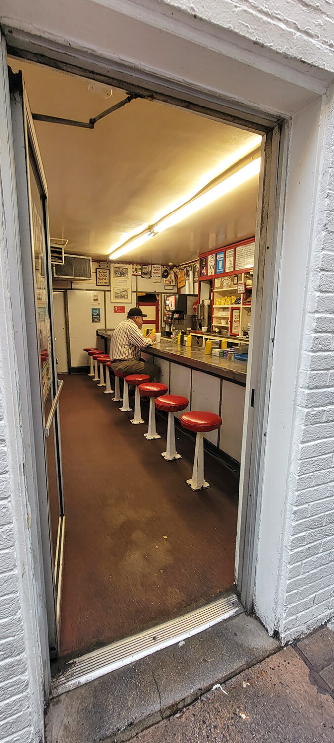 Step inside and you're transported to a simpler time&mdash;ten red stools, a narrow counter, and the promise of comfort food that hasn't changed in decades.