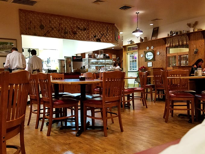 Classic wooden chairs and warm wood paneling create the perfect backdrop for Southern comfort food conversations.