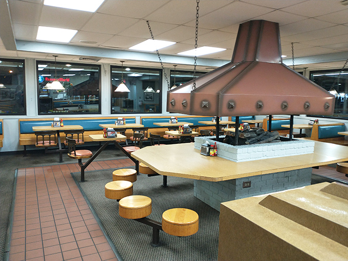 The copper hood centerpiece isn't just functional&mdash;it's practically a shrine where diners worship at the altar of perfectly steamed buns and secret-recipe chili.