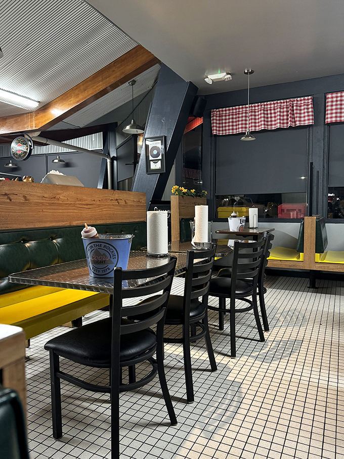 Classic checkered curtains and comfortable booths create that "you've arrived" feeling. The paper towel rolls aren't decorative&mdash;they're a promise of deliciously messy things to come.