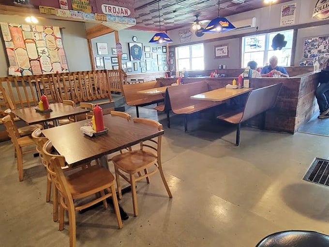 Wooden booths worn smooth by decades of satisfied diners create the perfect backdrop for serious eating. No pretension, just pure comfort.