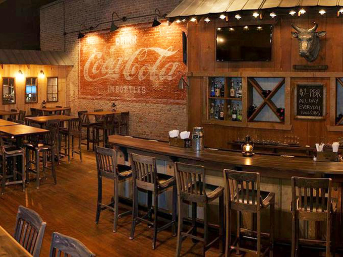 The vintage Coca-Cola mural isn't just decoration; it's Atlanta history painted on brick, watching over hungry patrons like a fizzy guardian angel.