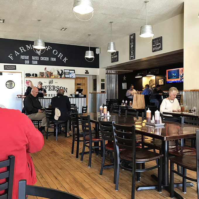 Where farm meets fork! The rustic-industrial interior combines wooden floors, metal accents, and pendant lighting to create the perfect backdrop for serious barbecue business.
