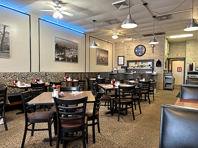 Inside, the blue accent lighting and classic diner aesthetic create that rare atmosphere where both conversation and comfort food flourish.