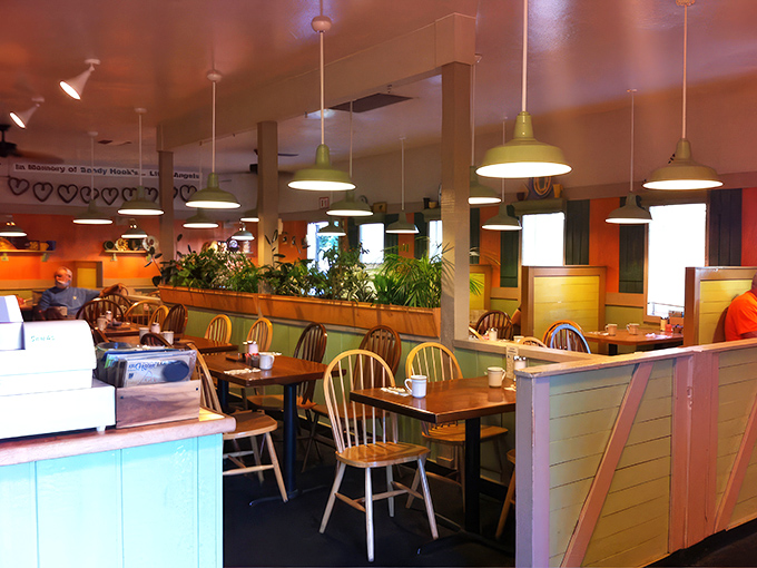 Warm lighting, wooden dividers, and Windsor chairs create that perfect "everybody knows your name" vibe where comfort food tastes even better.