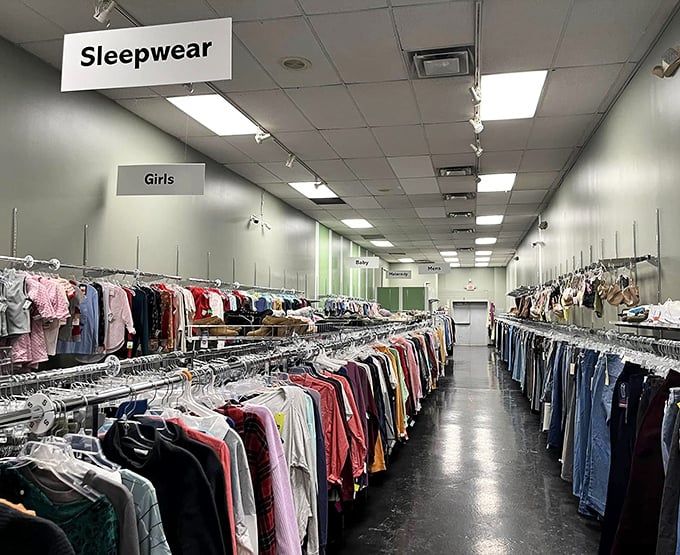Endless racks of carefully organized clothing stretch into the distance. The thrill of the hunt begins here, where fashion finds await at fraction-of-retail prices.