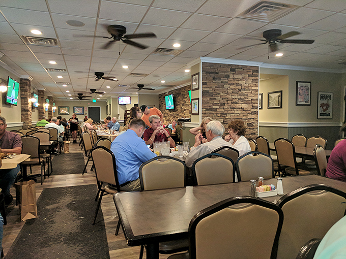 Inside, the comfortable dining room with stone accents and ceiling fans creates that perfect "come as you are" atmosphere where seafood and conversation flow freely.