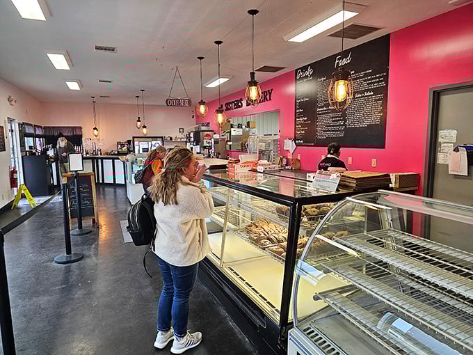 Inside, the vibrant pink wall and pendant lighting create the perfect backdrop for what's about to become your new favorite food obsession.