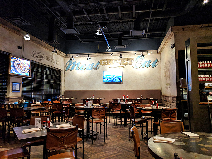 Industrial meets inviting with that "Meat Great Eat" wall art. The dining room feels like the living room of that cool friend who actually knows how to cook.