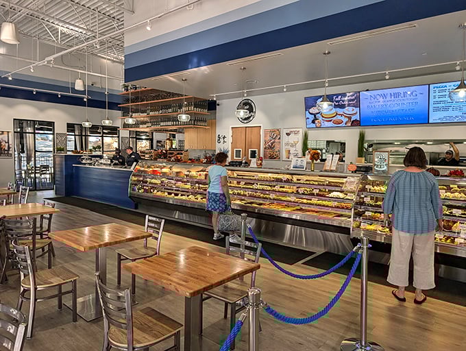 The display case stretches like a runway of dessert fashion, where each pastry seems to whisper, "Yes, you deserve me today."