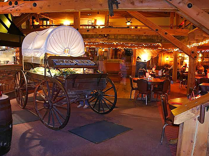 Step inside and you're transported to the Old West, where wagon wheels become chandeliers and timber beams frame your carnivorous adventure. 