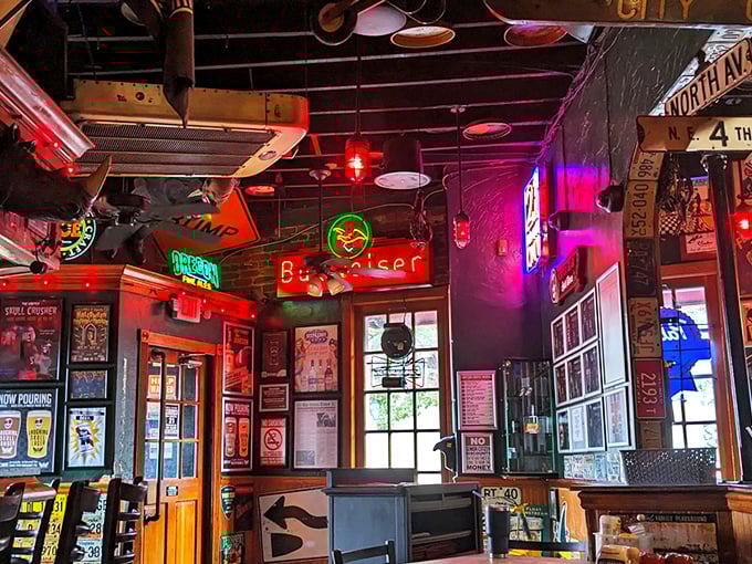 Inside The Vortex, neon signs compete for attention like contestants on a game show, creating a sensory playground that's equal parts dive bar and carnival.