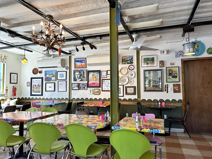 A gallery wall meets dining room &ndash; where local art and mismatched chairs create the feeling you're eating in your coolest friend's kitchen.