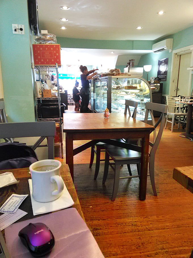 Rustic wooden tables and chairs create a cozy haven where calories don't count and coffee refills feel like acts of friendship. 