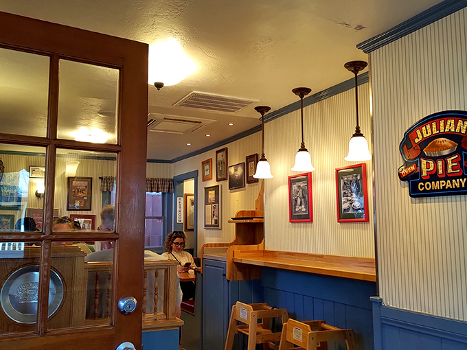 Blue wainscoting and warm pendant lighting create the perfect backdrop for pie-based epiphanies. Like Cheers, but with better desserts.