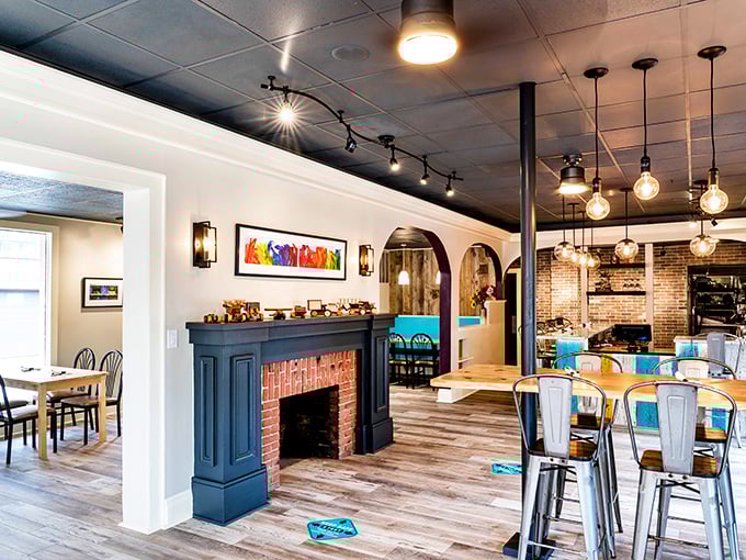 Edison bulbs, exposed brick, and that gorgeous fireplace create the perfect backdrop for morning conversations. Cozy enough for winter, airy enough for summer.