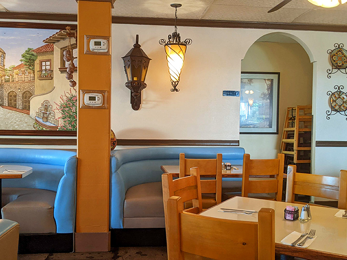 Blue booths and warm lighting create that "abuela's dining room" vibe. The wrought iron fixtures aren't just decoration&mdash;they're setting the stage for your taste buds' performance.