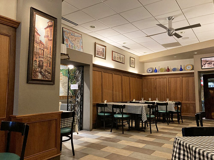 Classic checkered tablecloths and wood paneling create that "Nonna's dining room" vibe. No Edison bulbs or reclaimed wood here&mdash;just timeless comfort.
