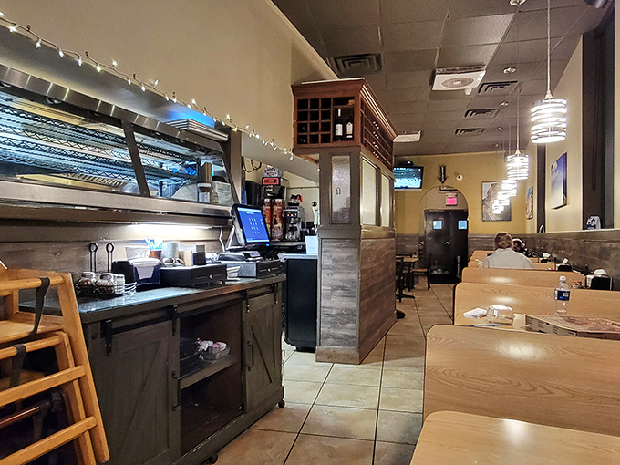 No-frills dining at its finest&mdash;wooden booths, yellow walls, and pendant lighting create the perfect backdrop for pizza perfection.