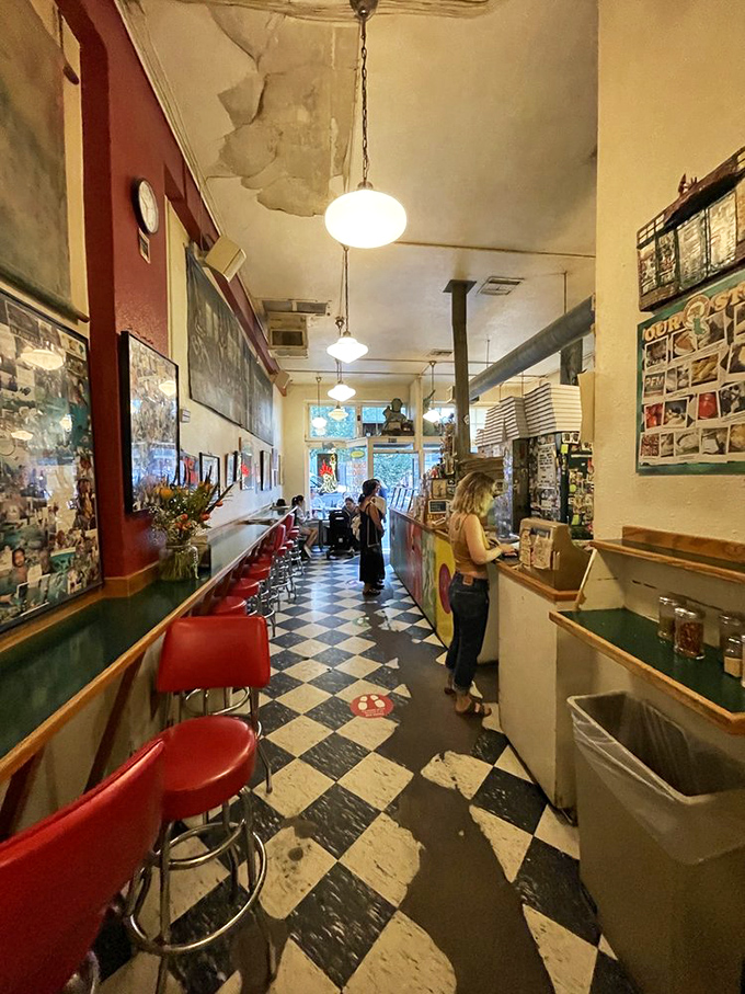 Step inside to a narrow space with classic black and white checkered floors&mdash;a pizza time capsule where authenticity reigns supreme. 