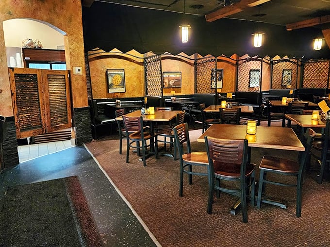 Warm earth tones and cozy booths create the perfect backdrop for pizza perfection. This isn't Instagram-bait d&eacute;cor&mdash;it's the real deal comfort zone.