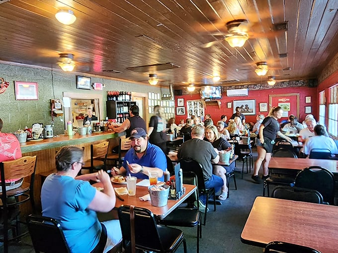 Inside, wood-paneled ceilings and red walls create that perfect "everybody knows your name" vibe. Hunger and anticipation hang in the air.