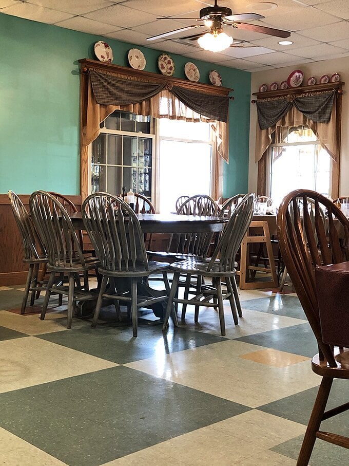 Mint green walls, decorative plates, and Windsor chairs create that "grandma's dining room" vibe&mdash;the universal signal that you're about to eat something worth unbuttoning your pants for.