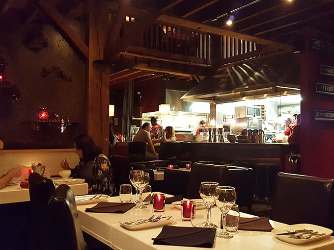 Where farm meets fancy. The interior's exposed beams and white tablecloths create the perfect marriage of rustic charm and fine dining elegance.