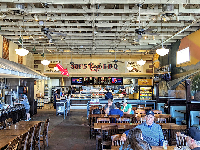 Inside, exposed beams and cafeteria-style service create that rare atmosphere where anticipation becomes part of the meal itself.