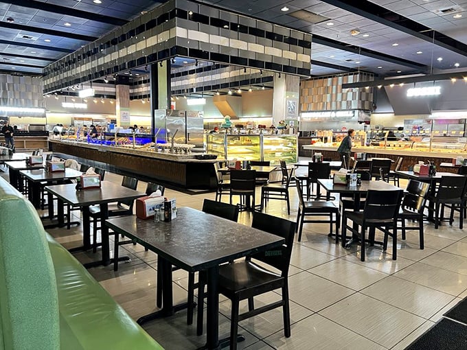 Modern, spacious interior with ample seating and well-organized food stations that invite exploration rather than the usual buffet chaos.