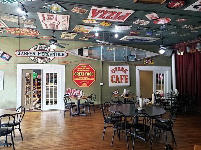 Nostalgia hangs from every inch of ceiling space, where vintage signs and a suspended canoe create an atmosphere that's equal parts museum and dining room.