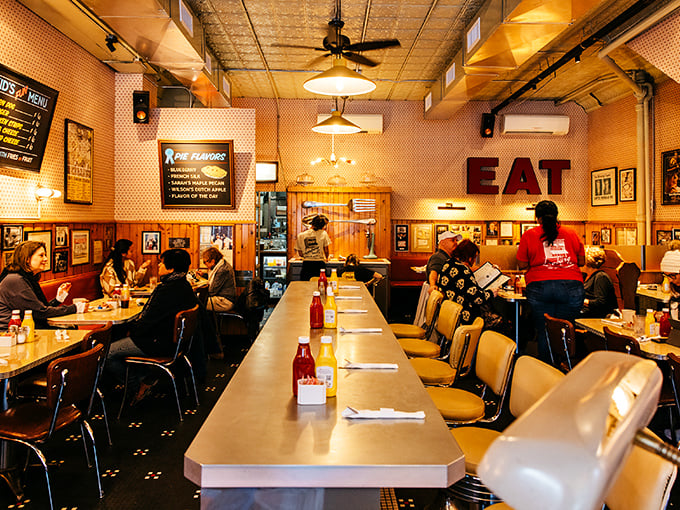 Inside, time stands still in the best possible way&mdash;wood paneling, counter seating, and that giant "EAT" sign that's really more invitation than command.