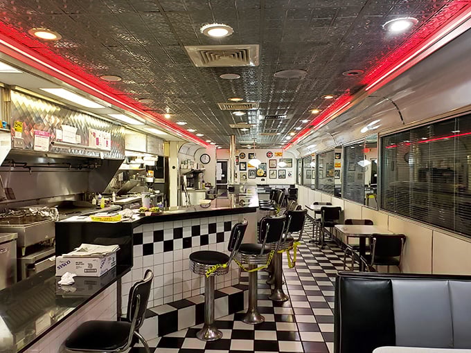 Classic black and white checkerboard floors lead to red-trimmed counters where strangers become friends over coffee and conversation.