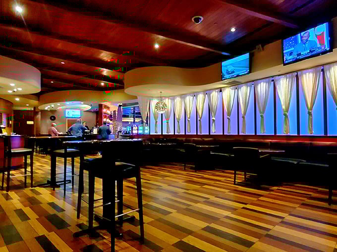 Warm wood tones, elegant lighting, and that colorful floor create an atmosphere that whispers "upscale" while still saying "relax, we're in Delaware."