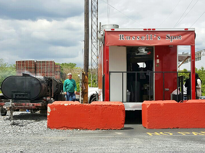 Behind that unassuming exterior lies a world of smoky magic. The real-deal smoker visible in the background is the not-so-secret weapon.