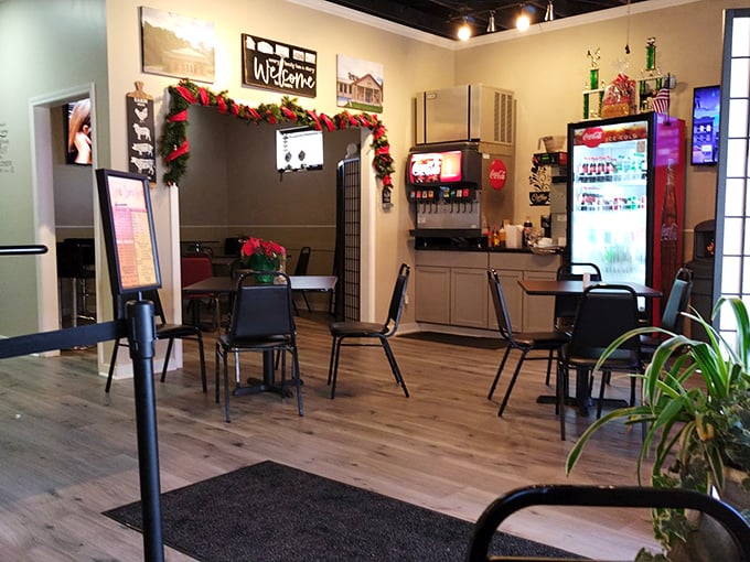 Simple tables, no-nonsense chairs, and a welcome sign that means business. This dining room isn't trying to impress you&mdash;until the food arrives.