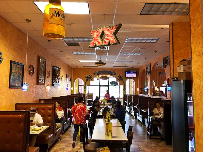 Inside, warm yellow walls and cozy booths create that "abuela's dining room" feeling, while Dos Equis signs remind you there's always a cold cerveza waiting.