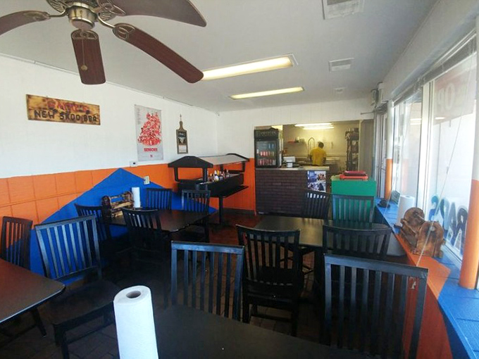 Simple tables, orange and blue walls, and a ceiling fan that's witnessed countless BBQ epiphanies. No fancy frills needed when the meat does all the talking.