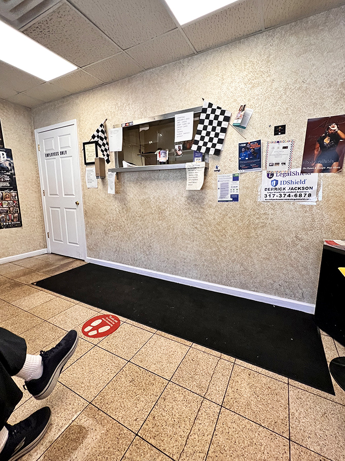 Racing flags frame the ordering window&mdash;a fitting nod to Indy's motorsport heritage. Your finish line? A tray of smoky perfection.