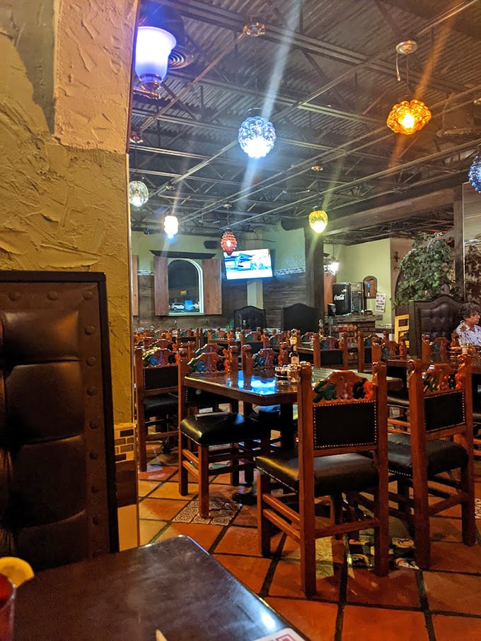 Colorful pendant lights cast a festive glow over handcrafted wooden furniture. This isn't designer ambiance&mdash;it's something far better: authenticity.