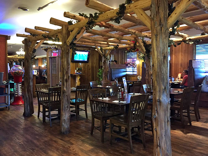 Inside, rough-hewn log beams create intimate dining spaces that feel like you've stumbled into a mountain lodge that happens to serve incredible Mexican cuisine.