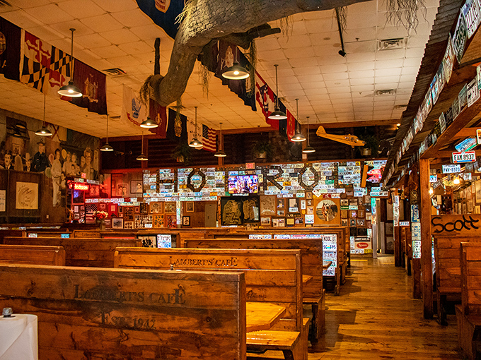 Step inside Lambert's and you're greeted by a museum-like interior where every inch tells a story. Wooden booths await hungry travelers amid memorabilia-covered walls.