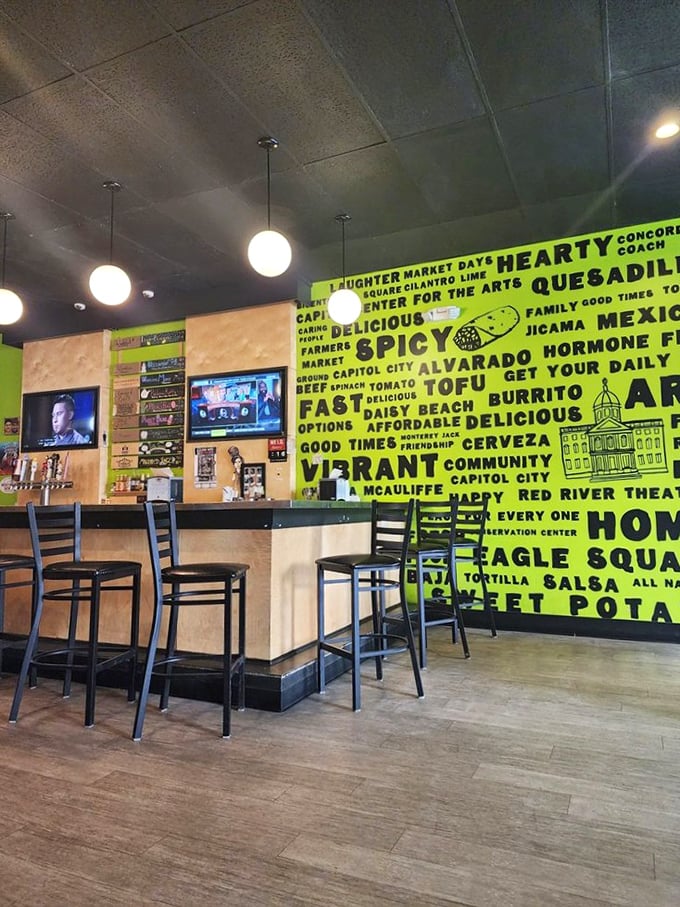 That vibrant lime-green wall isn't just decoration&mdash;it's a manifesto of community connection and food philosophy that sets the tone for your meal.