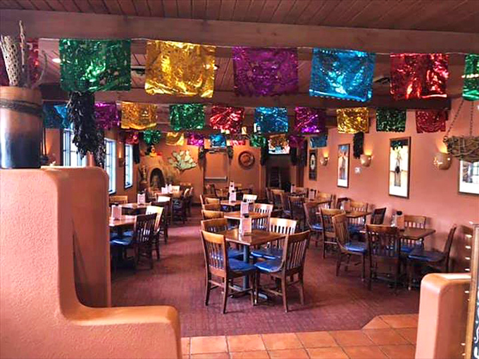 Stepping inside feels like instant transportation to Santa Fe, with warm terracotta walls, Southwestern d&eacute;cor, and a kiva fireplace that practically whispers "stay awhile."