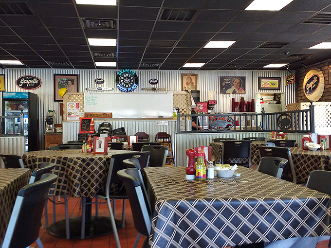 Inside, checkered tablecloths and corrugated metal walls create that perfect "come-as-you-are" atmosphere where the food, not the decor, takes center stage.