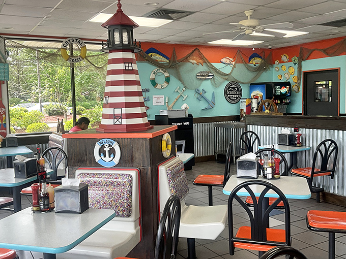 Nautical whimsy meets serious seafood inside, where that red-and-white lighthouse stands sentinel over your impending feast.