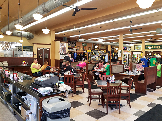 Inside, time slows down as checkerboard floors and wooden booths create the backdrop for conversations that matter more than whatever's happening on your phone.